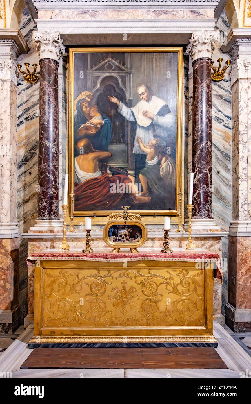 Visitors admire the ornate altar and painting honoring Saint Valentine ...