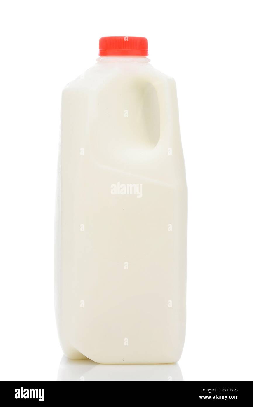 A one quart plastic bottle of milk, with red cap and no label., on ...