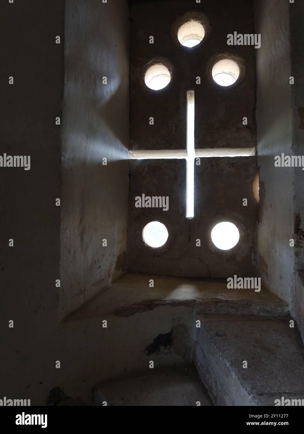 Daylight floods through the apertures in the windows creating a ...