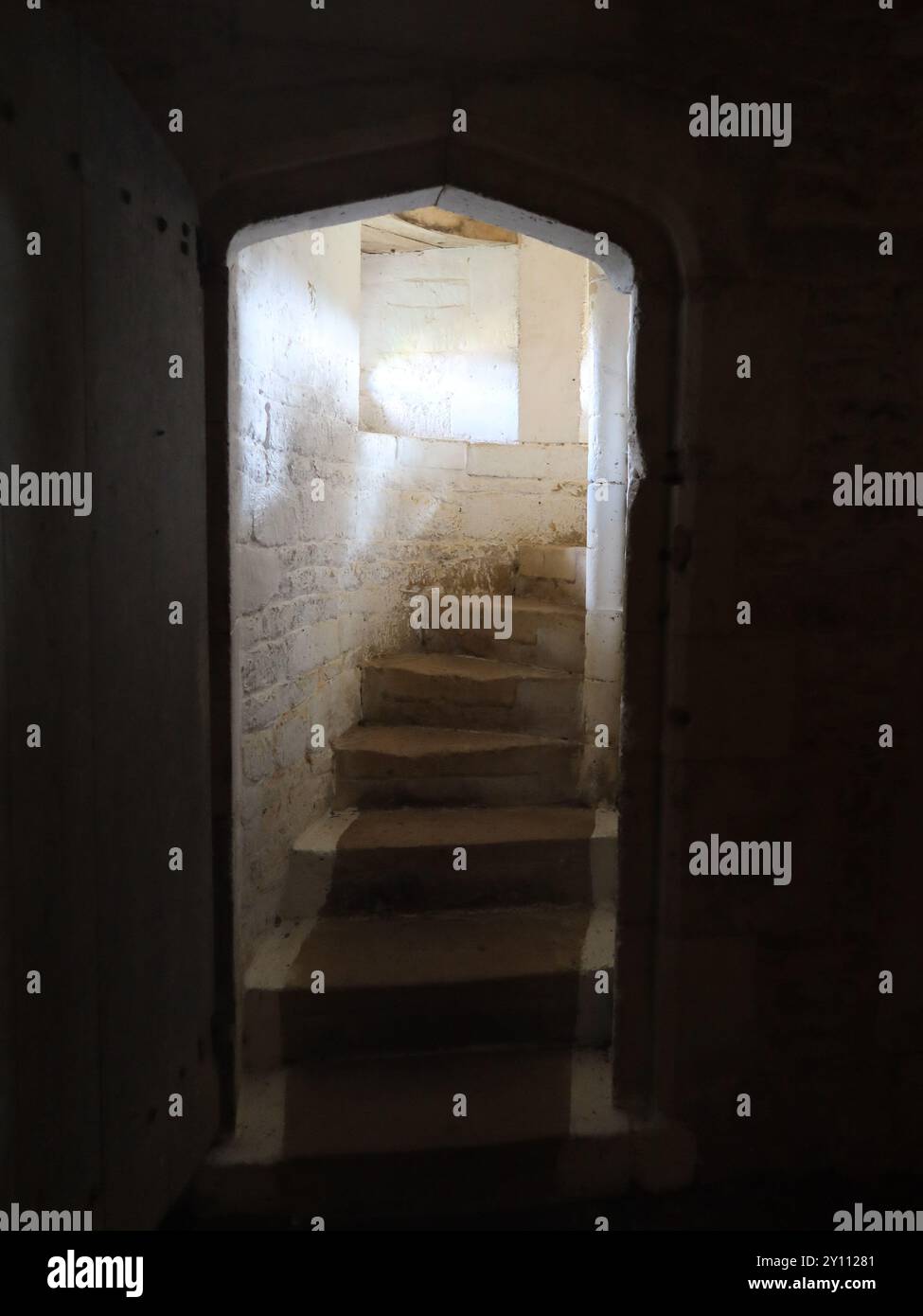 View through a doorway of the beginning of the narrow, steep stone ...