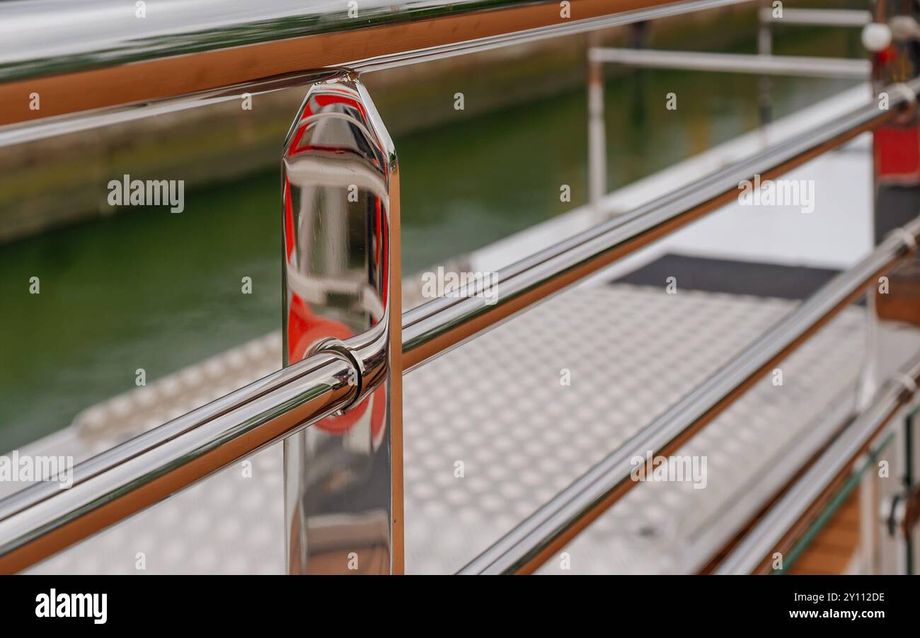 Polished Stainless Steel Railing on Boat Deck with Green Water ...