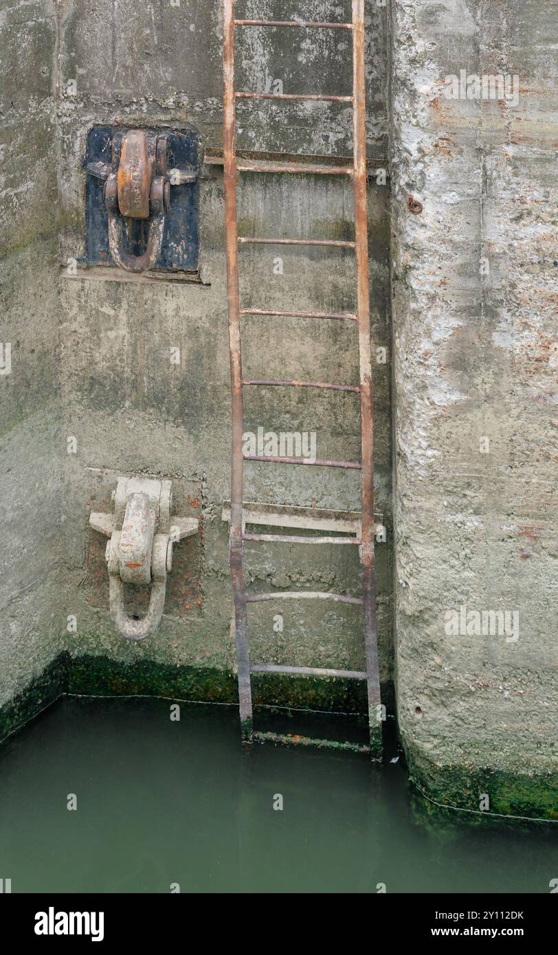 Rusty Ladder and Mooring Hooks in Concrete Lock Chamber Stock Photo - Alamy