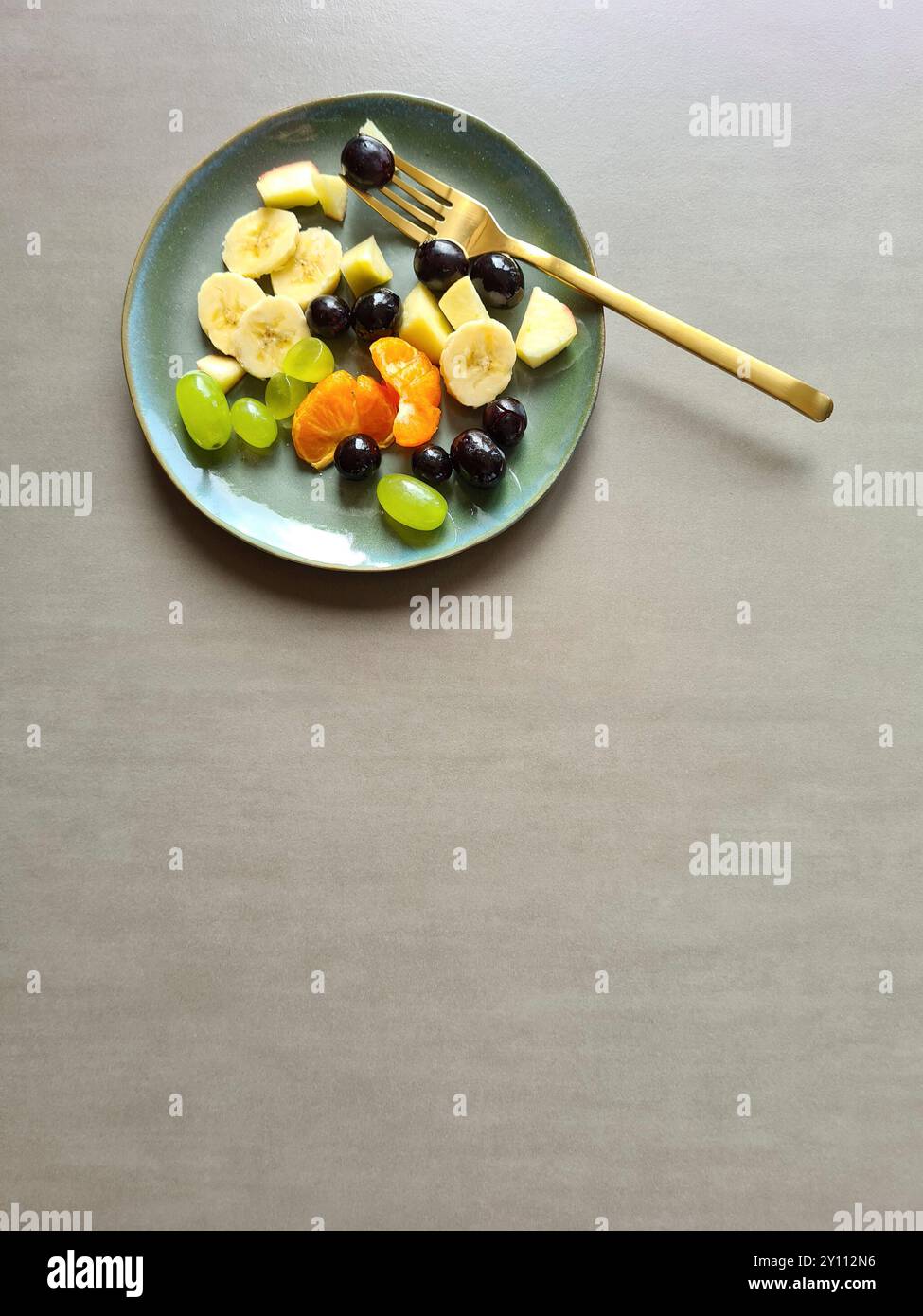 Fresh fruit on a white green plate, vitamin-rich nutrition, healthy ...