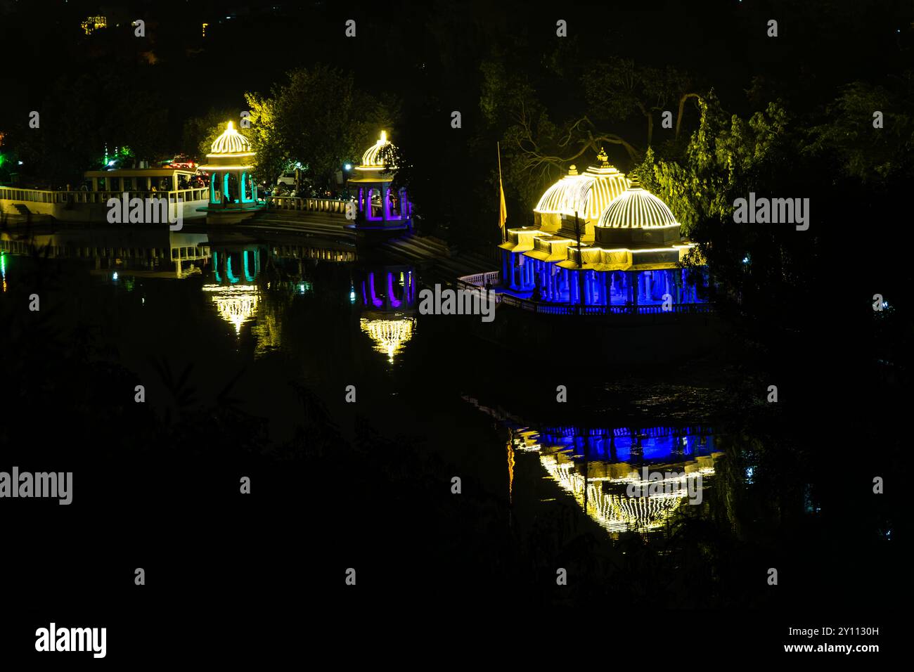 historical architecture decorated with ferry colorful lights and water ...