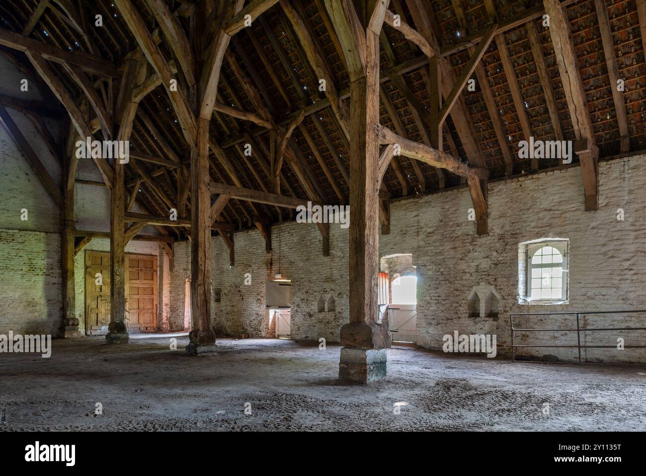 Interior showing wooden truss of 13th century Gothic monastic tithe ...