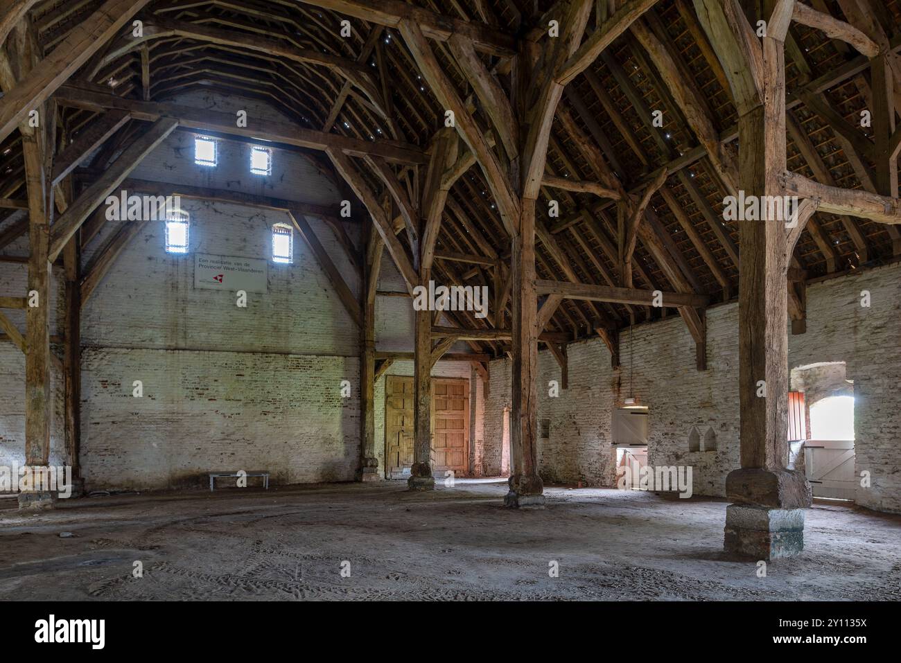 Interior showing wooden truss of 13th century Gothic monastic tithe ...
