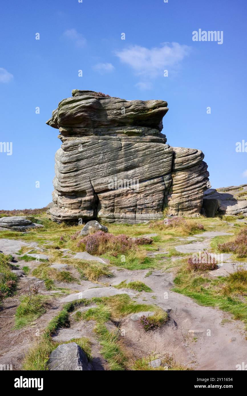 Mother Cap Large rock formation in a grassy moorland terrain under a ...