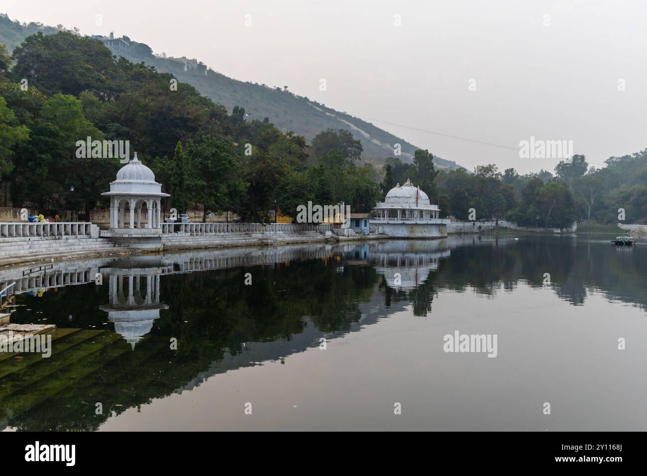 artistic city architecture with clam lake water reflection at morning ...