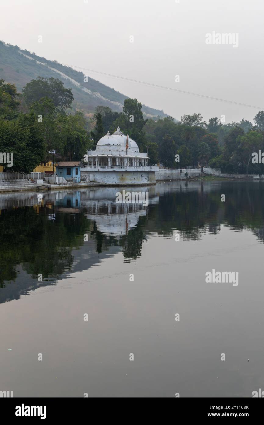 artistic city architecture with clam lake water reflection at morning ...