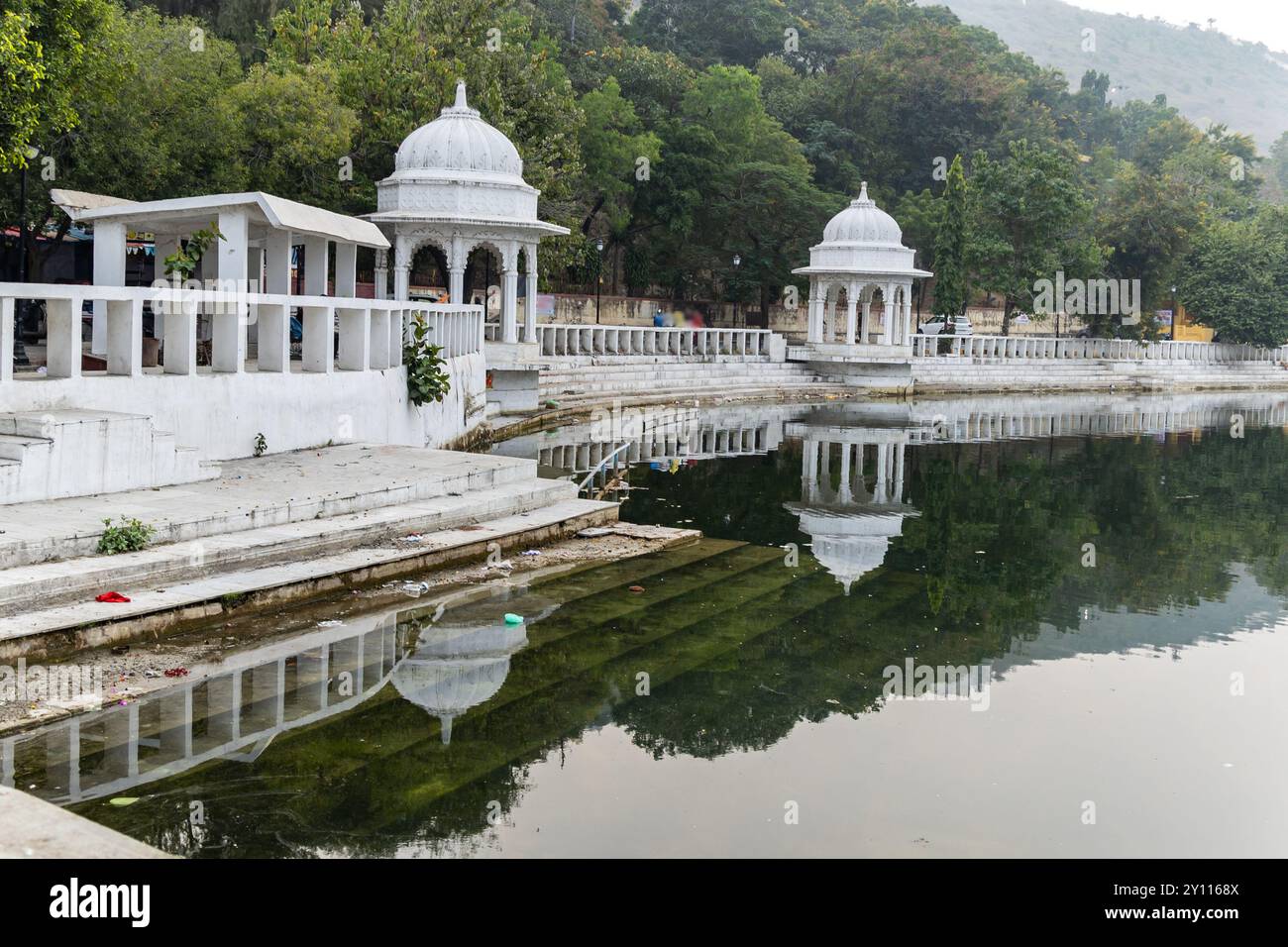 artistic city architecture with clam lake water reflection at morning ...