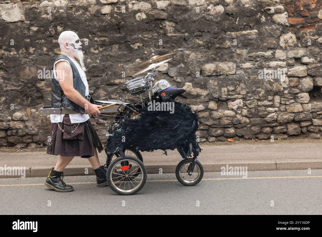 Raven drummers group drummer pushing portable drum set in street hi-res ...