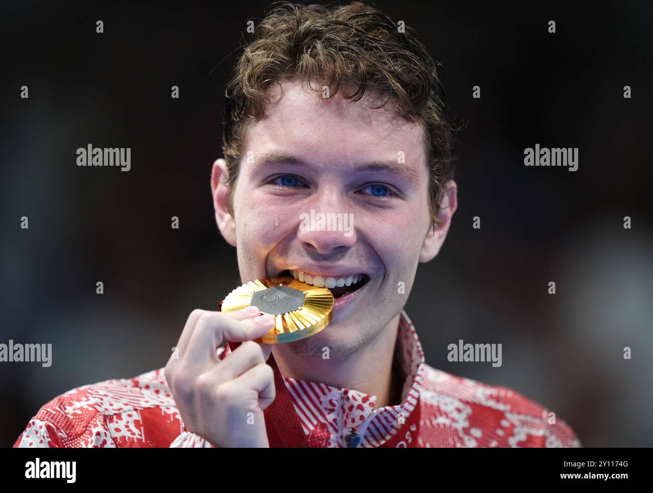Canada's Nicholas Bennett sheds a tear as he celebrates with the gold ...