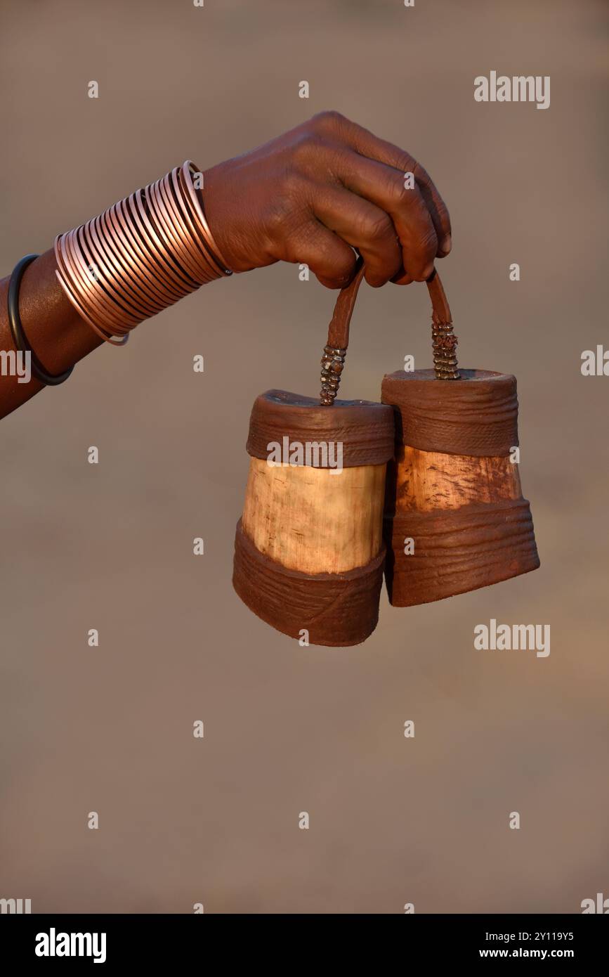 Arm jewelry of a young Himba woman and butterfat container, Kaokoveld ...