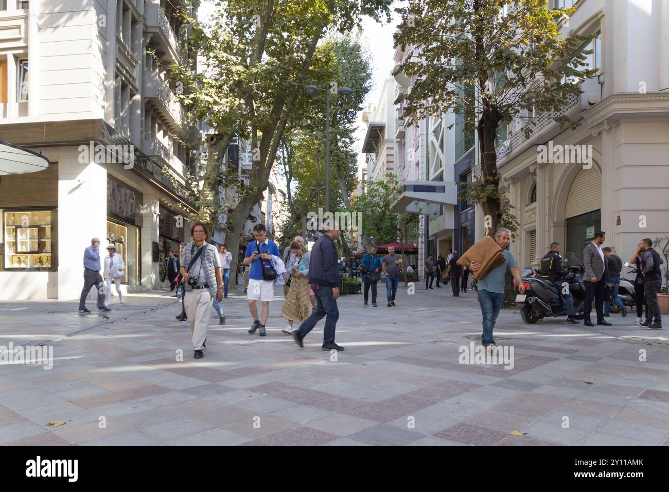 Urban Stroll: Daily life on a tree-lined city street in ıstanbul, turkey Stock Photo - Alamy