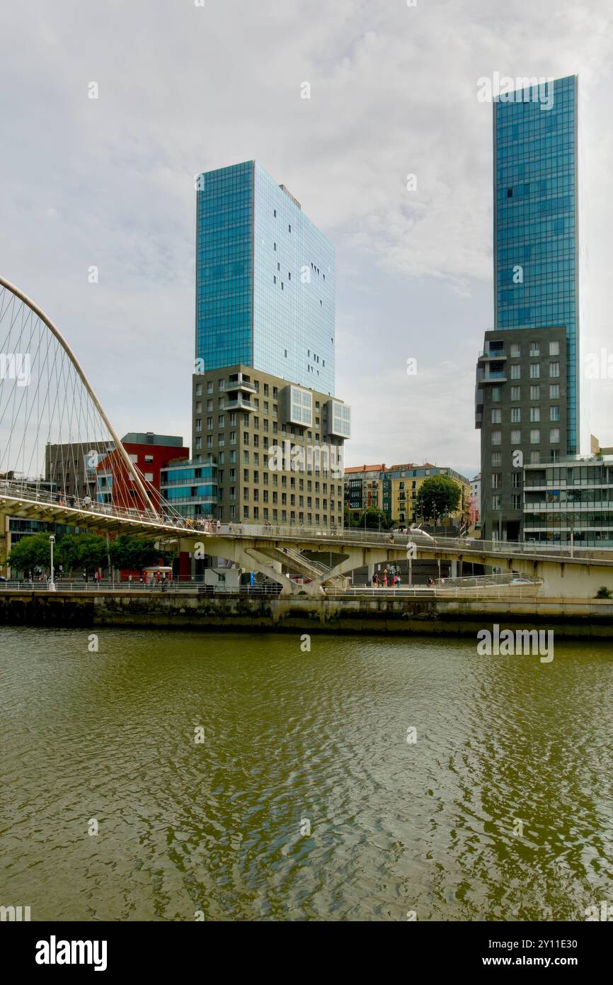 The twin towers of the Isozaki Gate complex and the tied arch Zubizuri ...