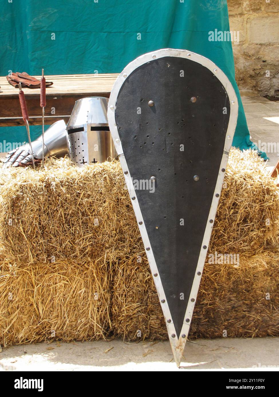Medieval suit of armor and a steel helmet in an outdoor still-life ...