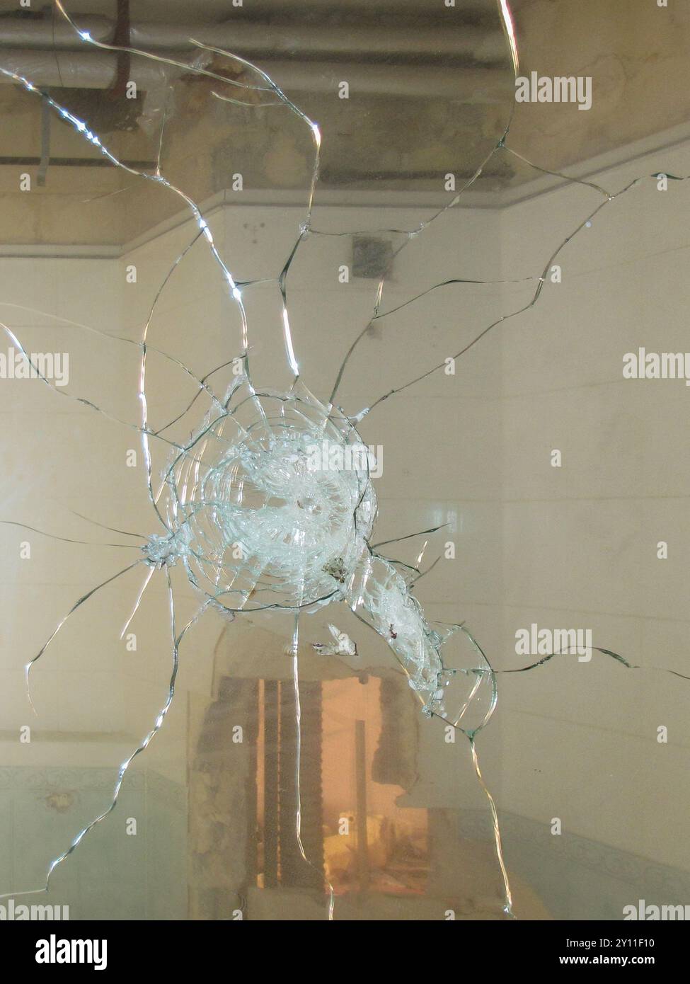 Cracked mirrors with shattered glass on indoor backgrounds Stock Photo ...