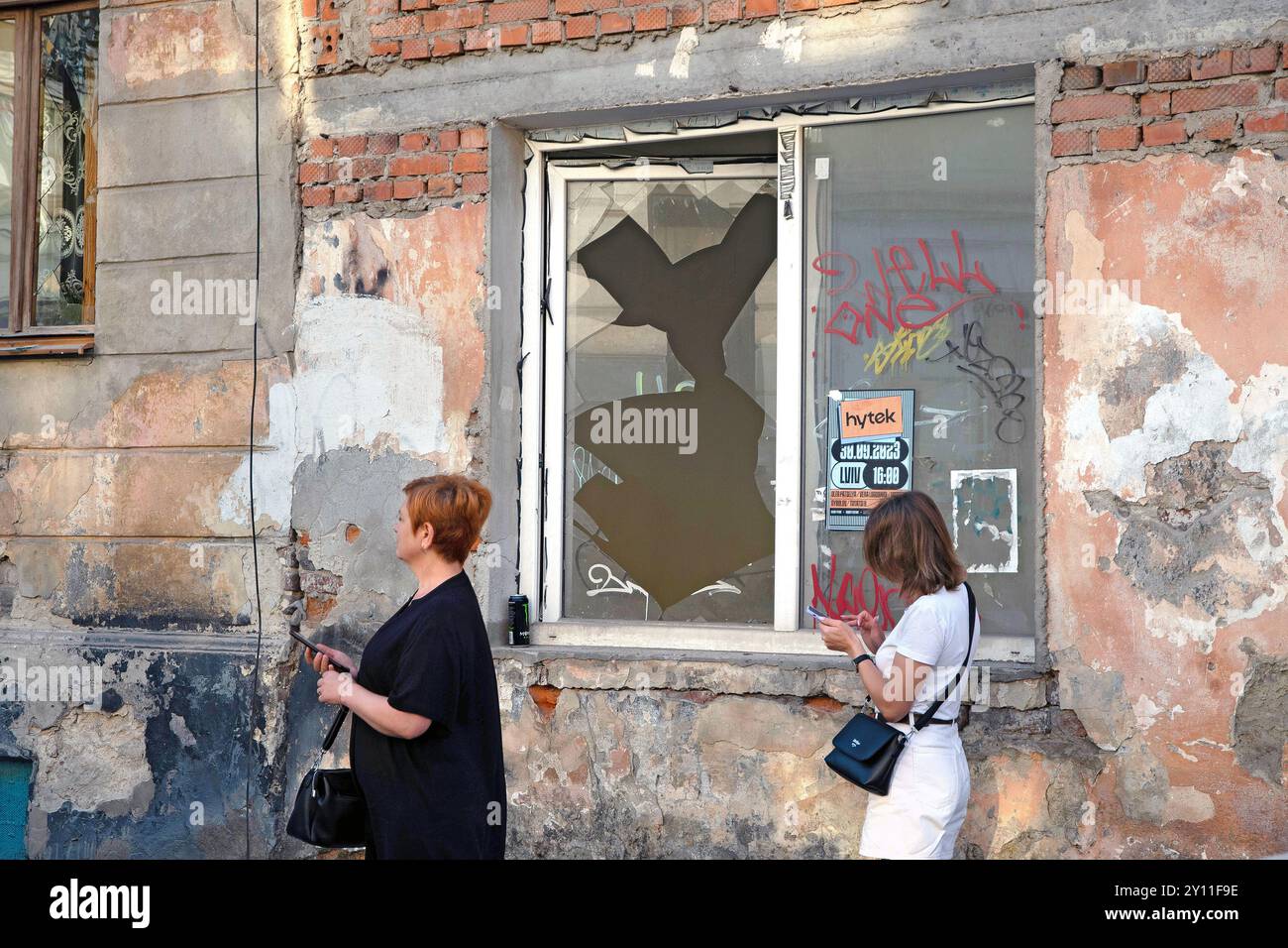 Non Exclusive: LVIV, UKRAINE - SEPTEMBER 4, 2024 - Two women walk past ...