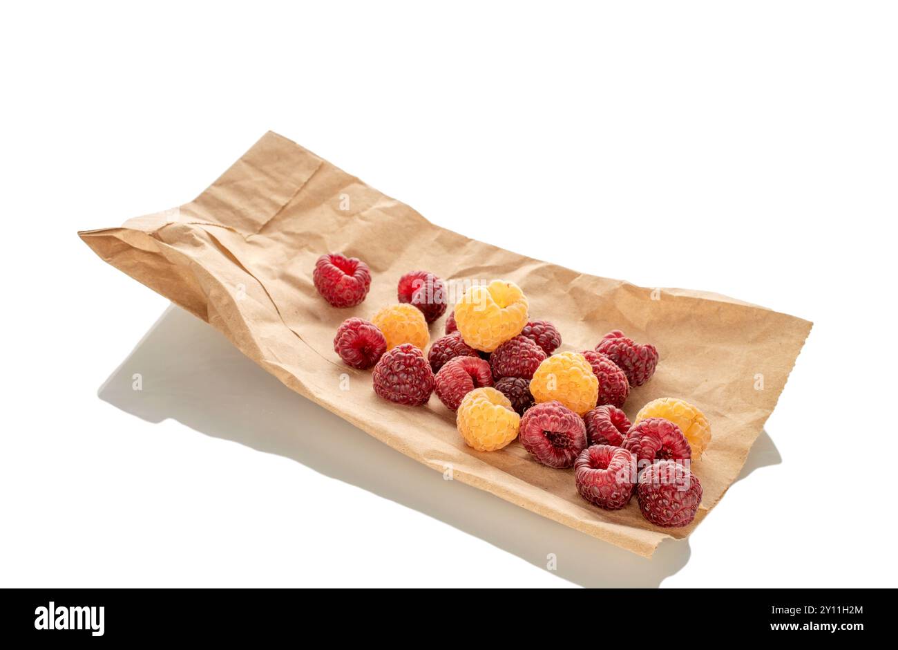 Fresh raspberry with paper bag, macro, isolated on white background ...