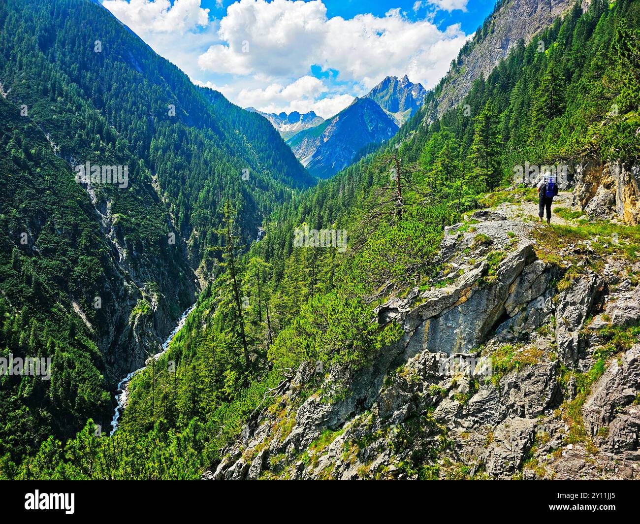 Hikers descending through the Zammer Loch to Zams, Tyrol, Austria, long ...