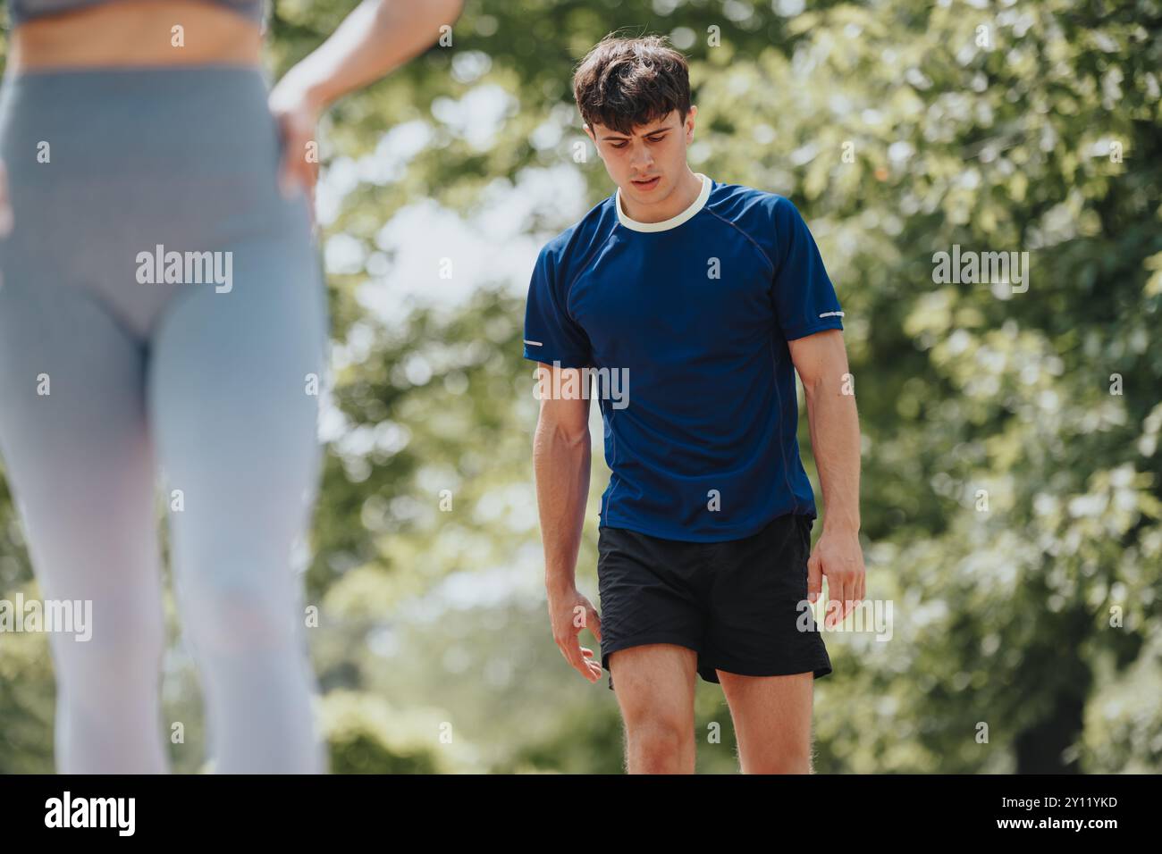 Young athletes cooling down after a workout in an outdoor park Stock ...