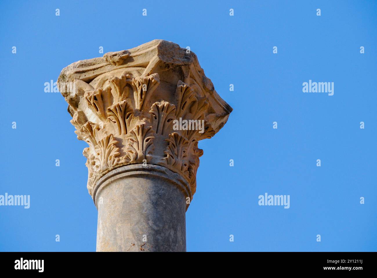 Greco-Roman column of the historic ancient city of Ephesus with blue ...