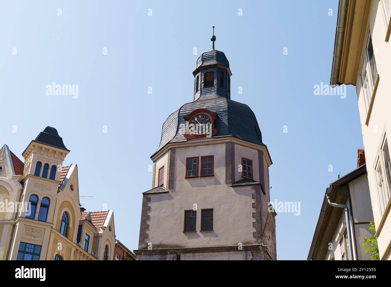 The timeless clock tower in Waltershausen stands proudly against a ...