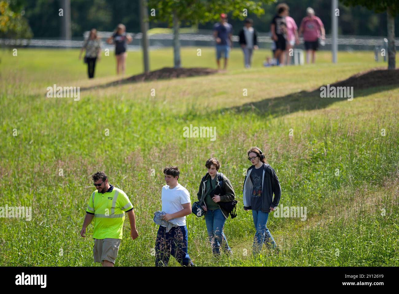 Students and parents walk off campus at Apalachee High School ...