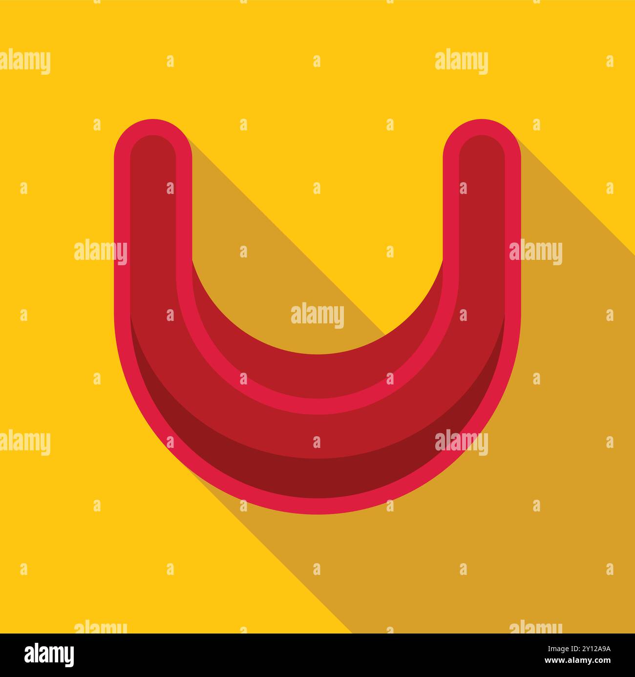 Red u shaped magnet casting strong shadow on yellow background, simple ...