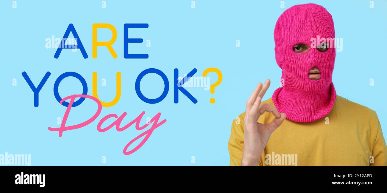 Banner for R U OK Day with young man in balaclava on light blue ...