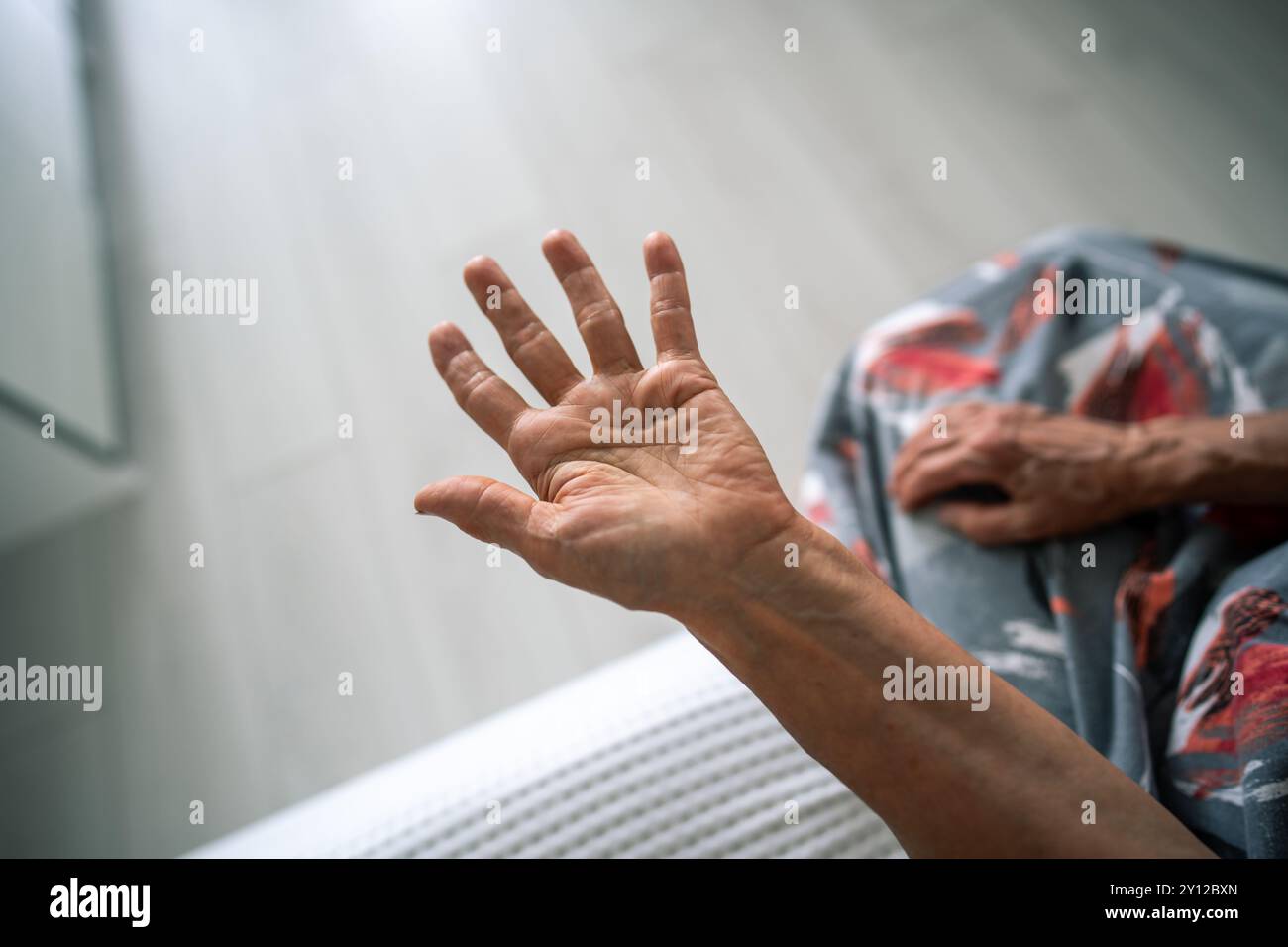 Hand tendon disease. Cropped woman hand with dense node under finger ...