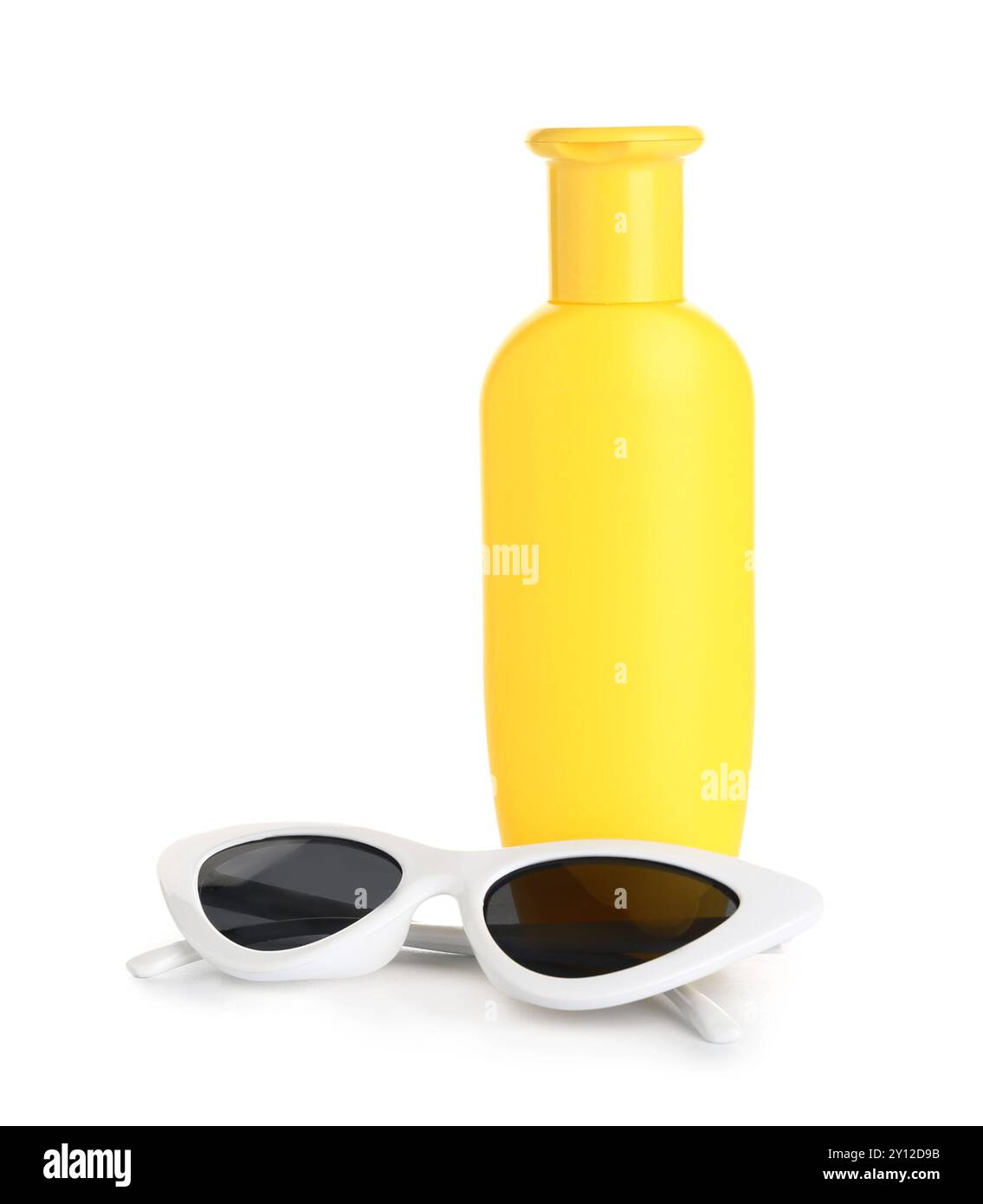 Sunglasses with bottle of sunscreen cream isolated on white background ...