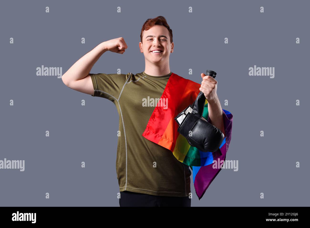 Male boxer with LGBT flag showing muscles on grey background Stock ...