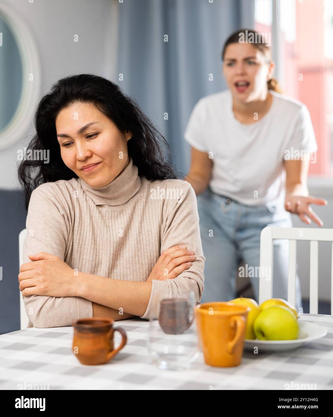 Outraged girl yells at her friend during domestic quarrel Stock Photo ...