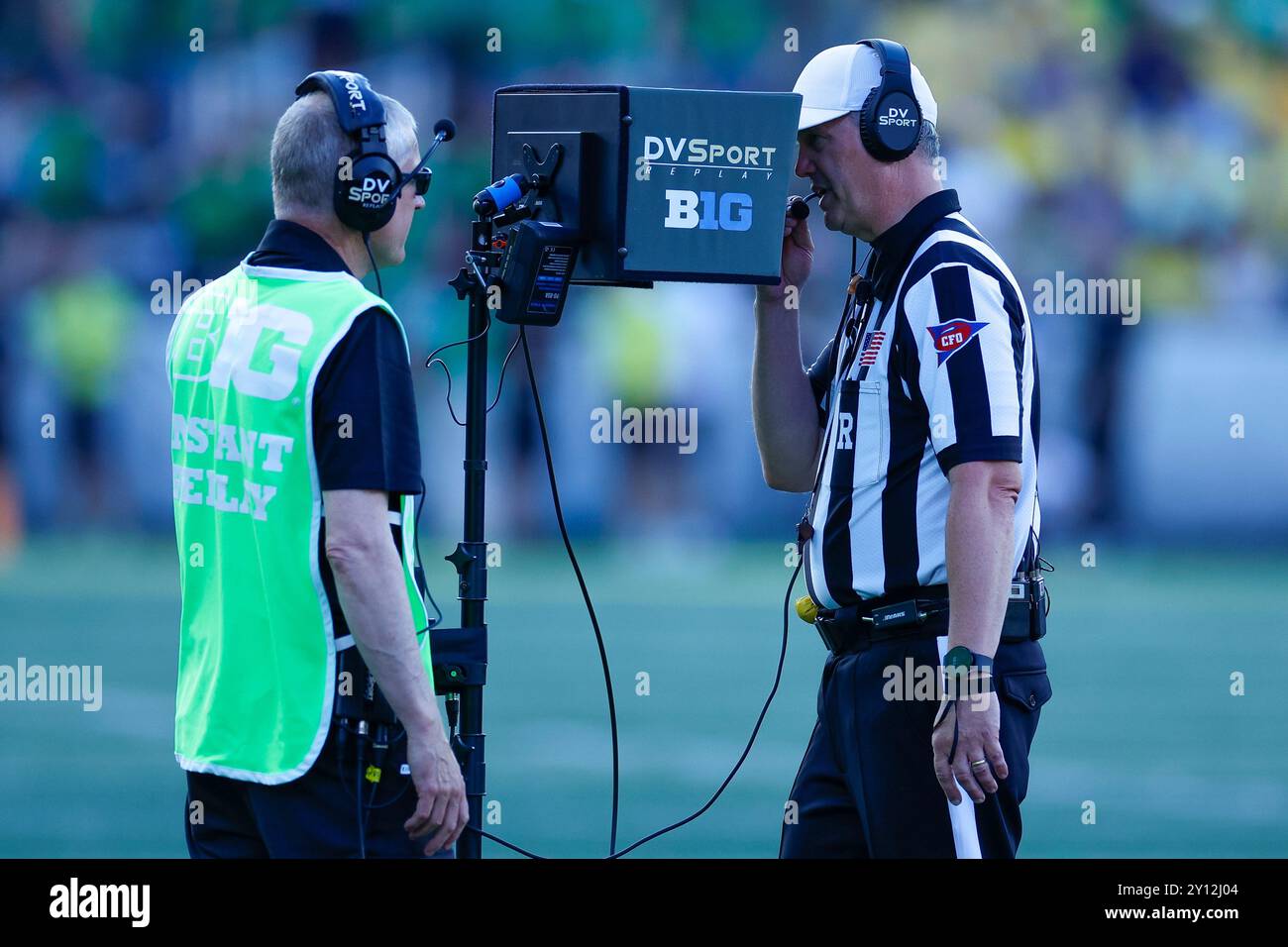A referee watches a Big 10 review screen during a game between the ...