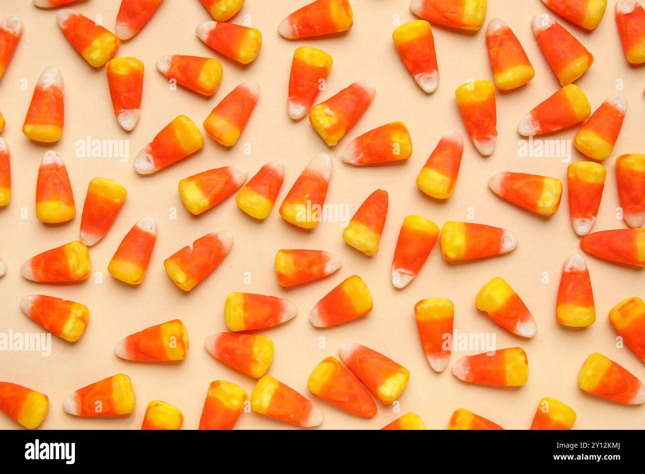 Composition with tasty Halloween candy corns on color background Stock ...