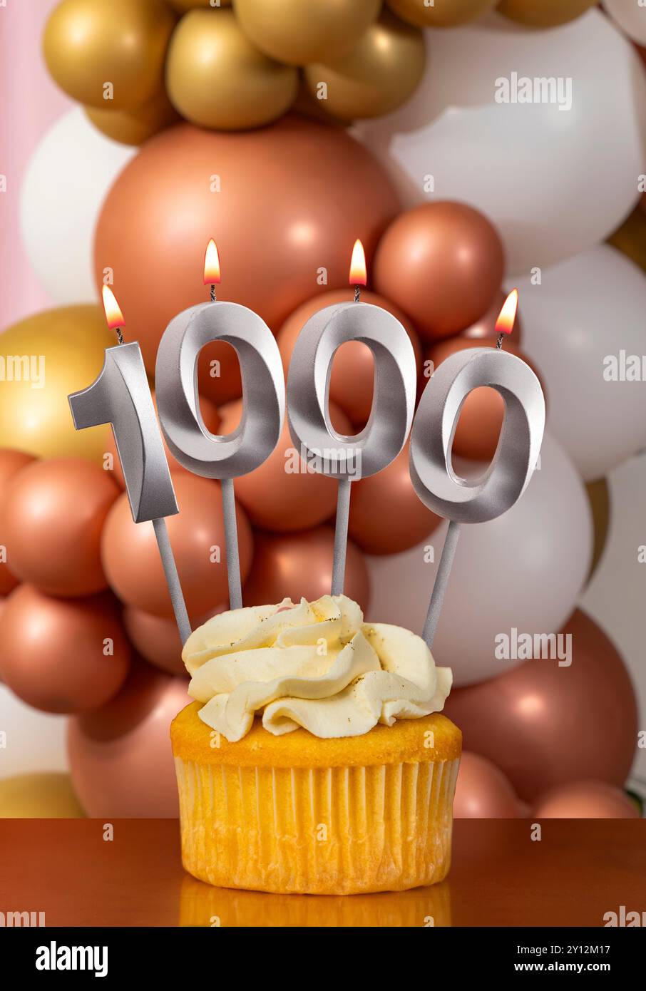 Cupcake with birthday candle on balloons background - Number 1000 Stock ...