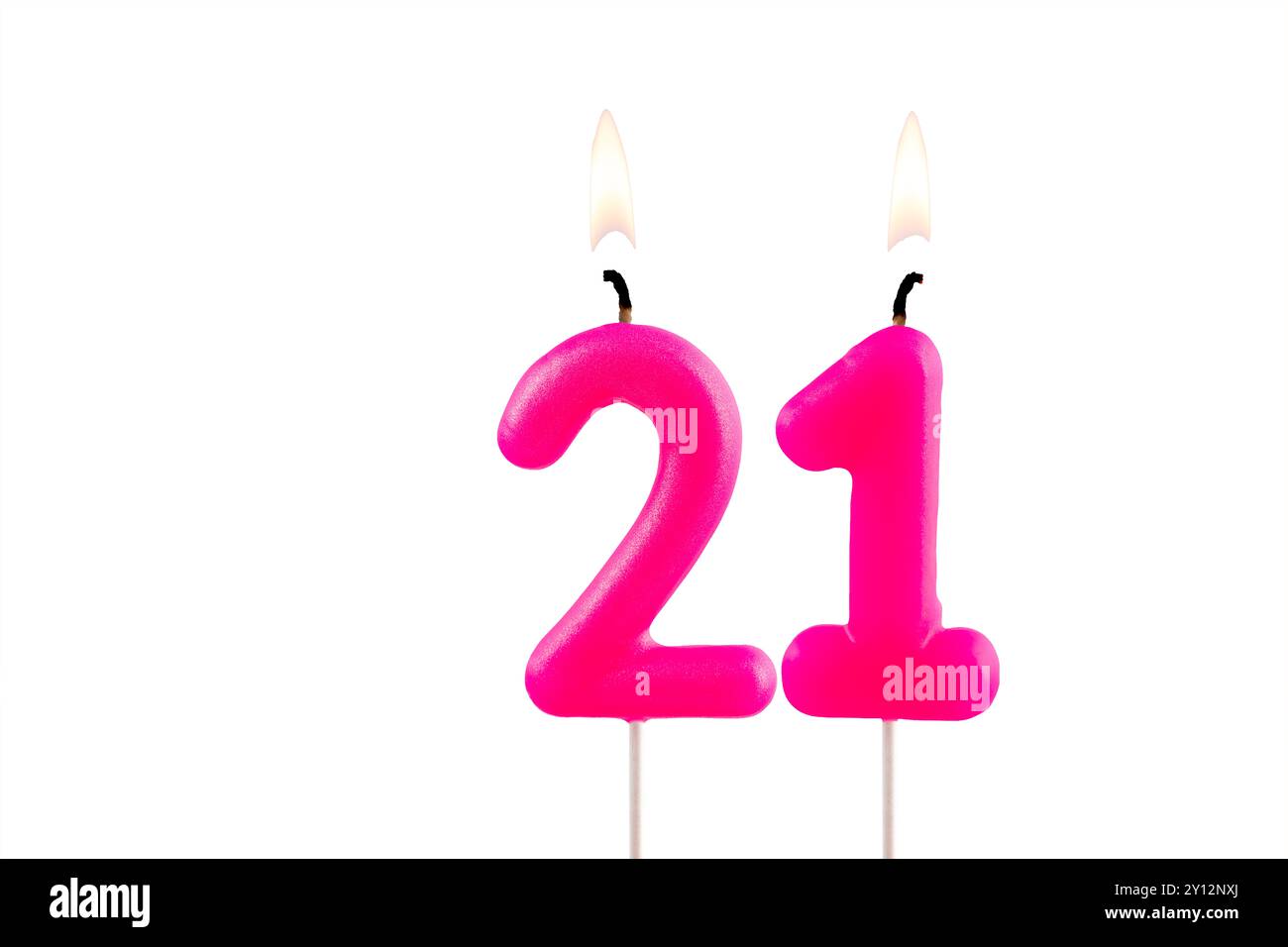 Pink number 21 birthday candle on white background Stock Photo - Alamy