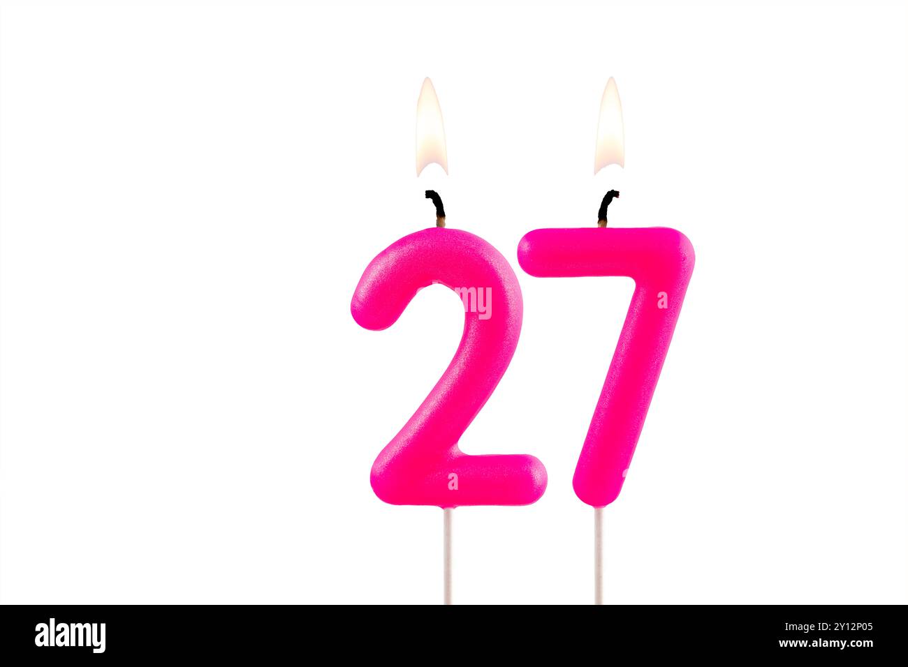 Pink number 27 birthday candle on white background Stock Photo - Alamy