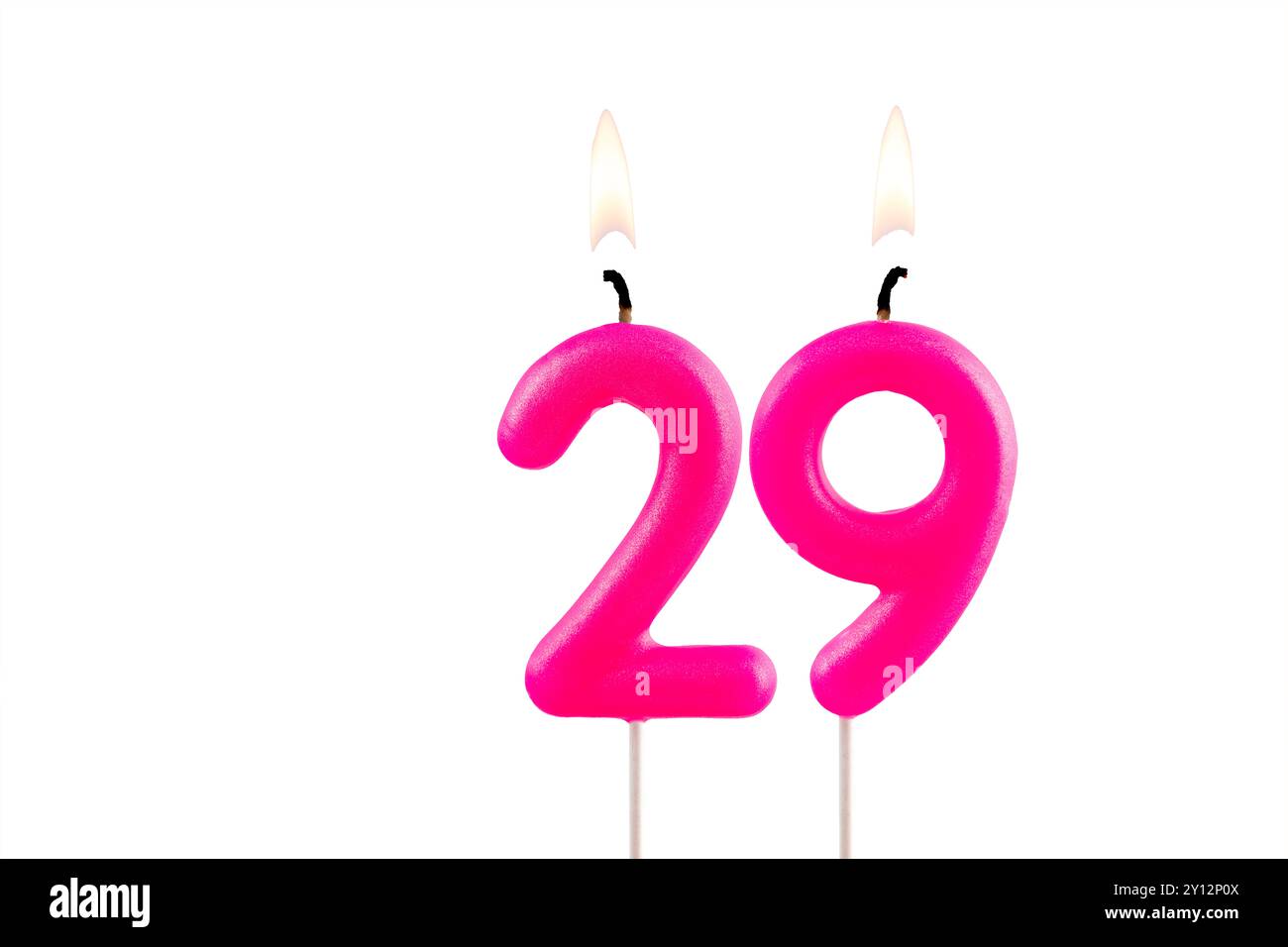 Pink number 29 birthday candle on white background Stock Photo - Alamy