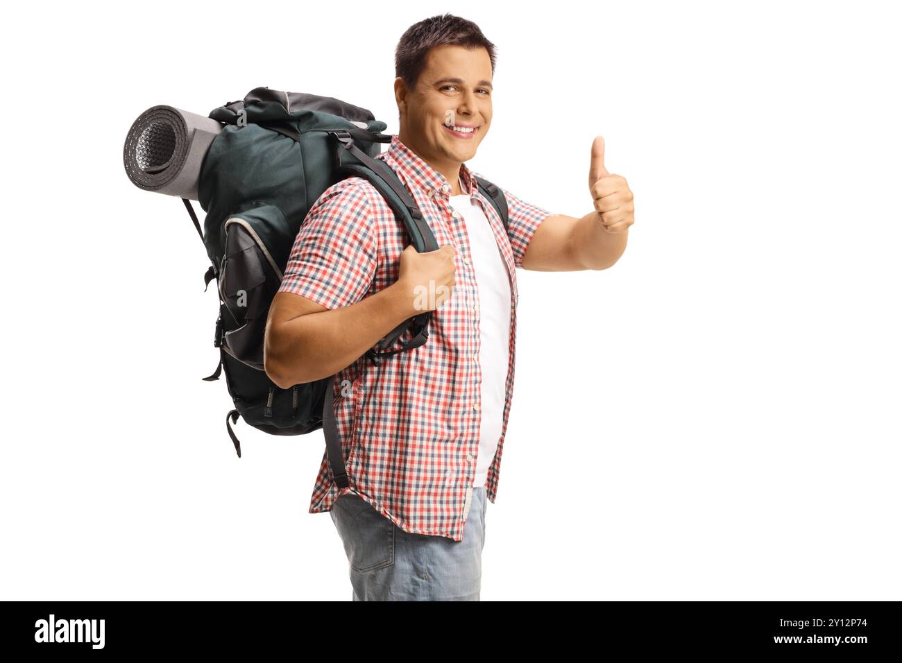 Male backpacker carrying backpack with equipment and gesturing thumbs ...