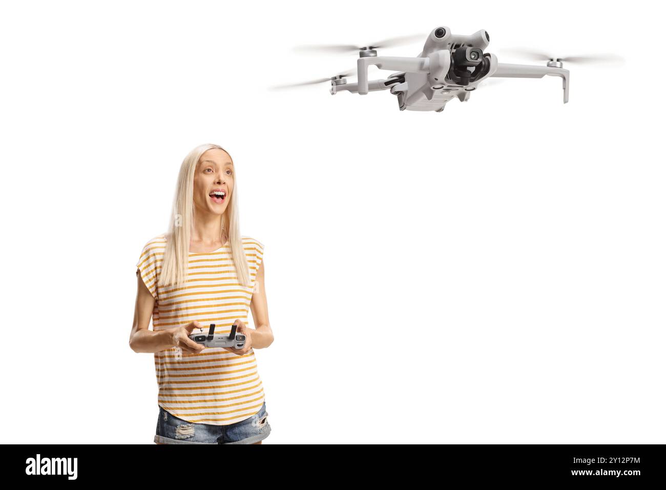 Young woman flying a drone isolated on white background Stock Photo - Alamy