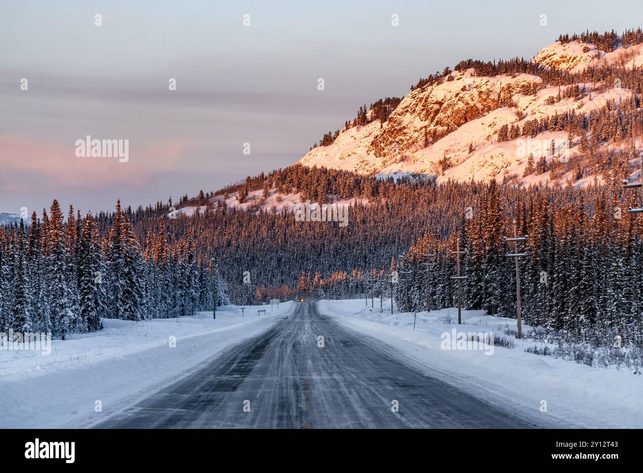 Wilderness road, highway in northern Canada with mountains towering ...