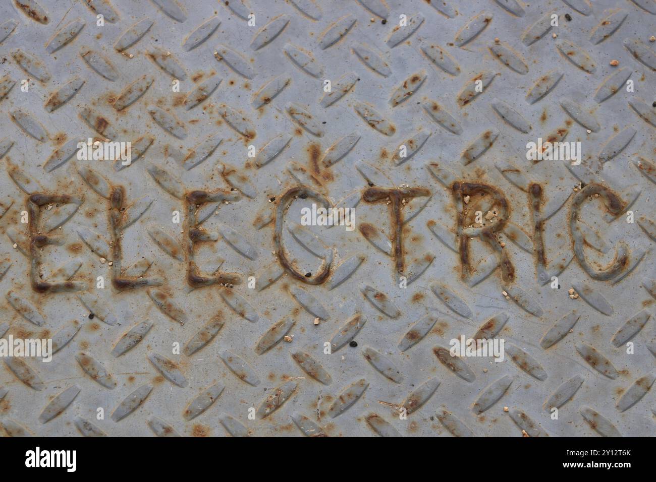 electric metal plate covering on ground Stock Photo - Alamy