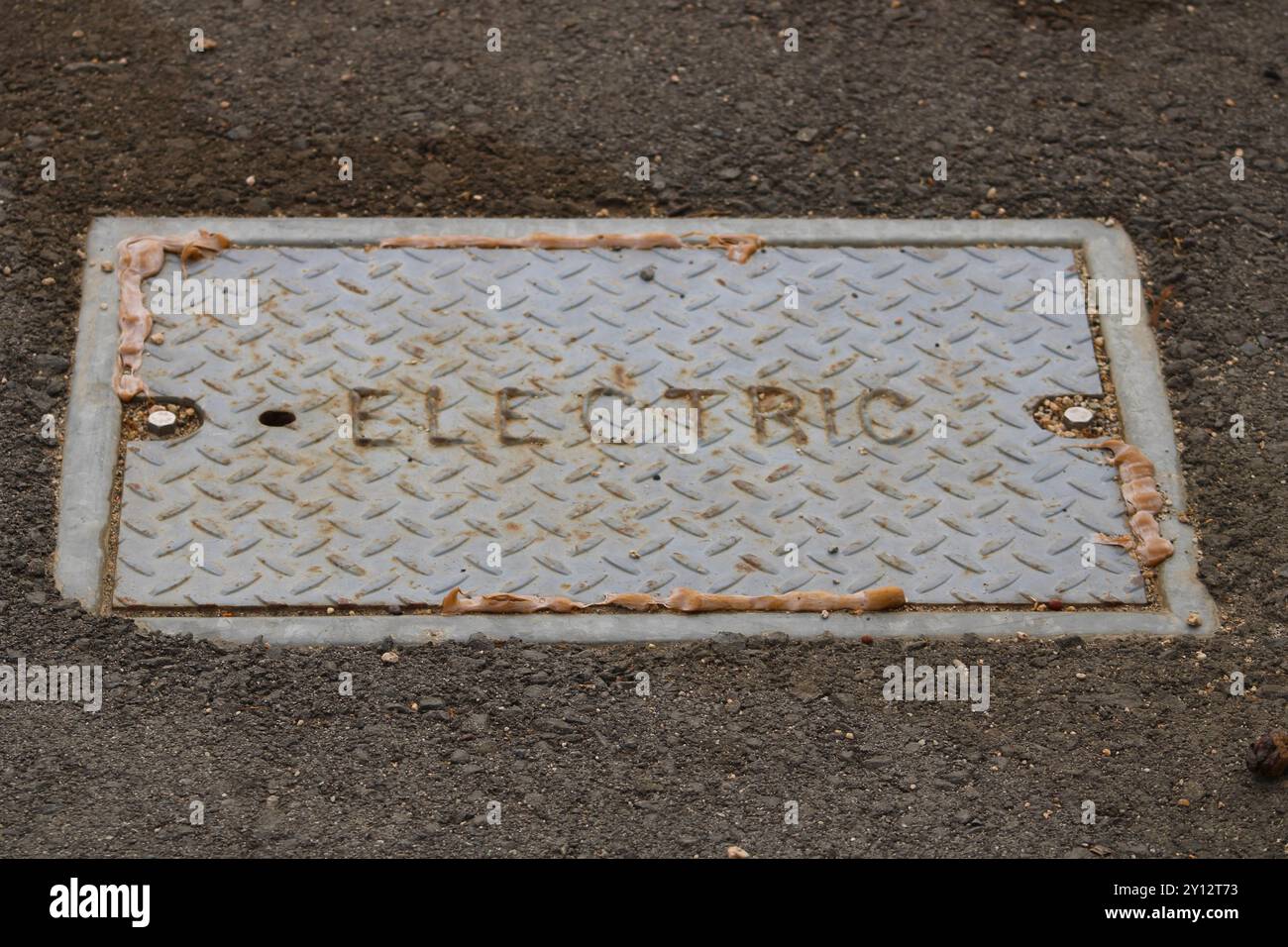 electric metal plate covering on ground Stock Photo - Alamy