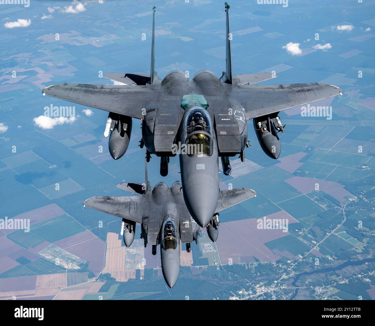 Two F-15 Strike Eagles, assigned to the 4th Fighter Wing, fly in ...