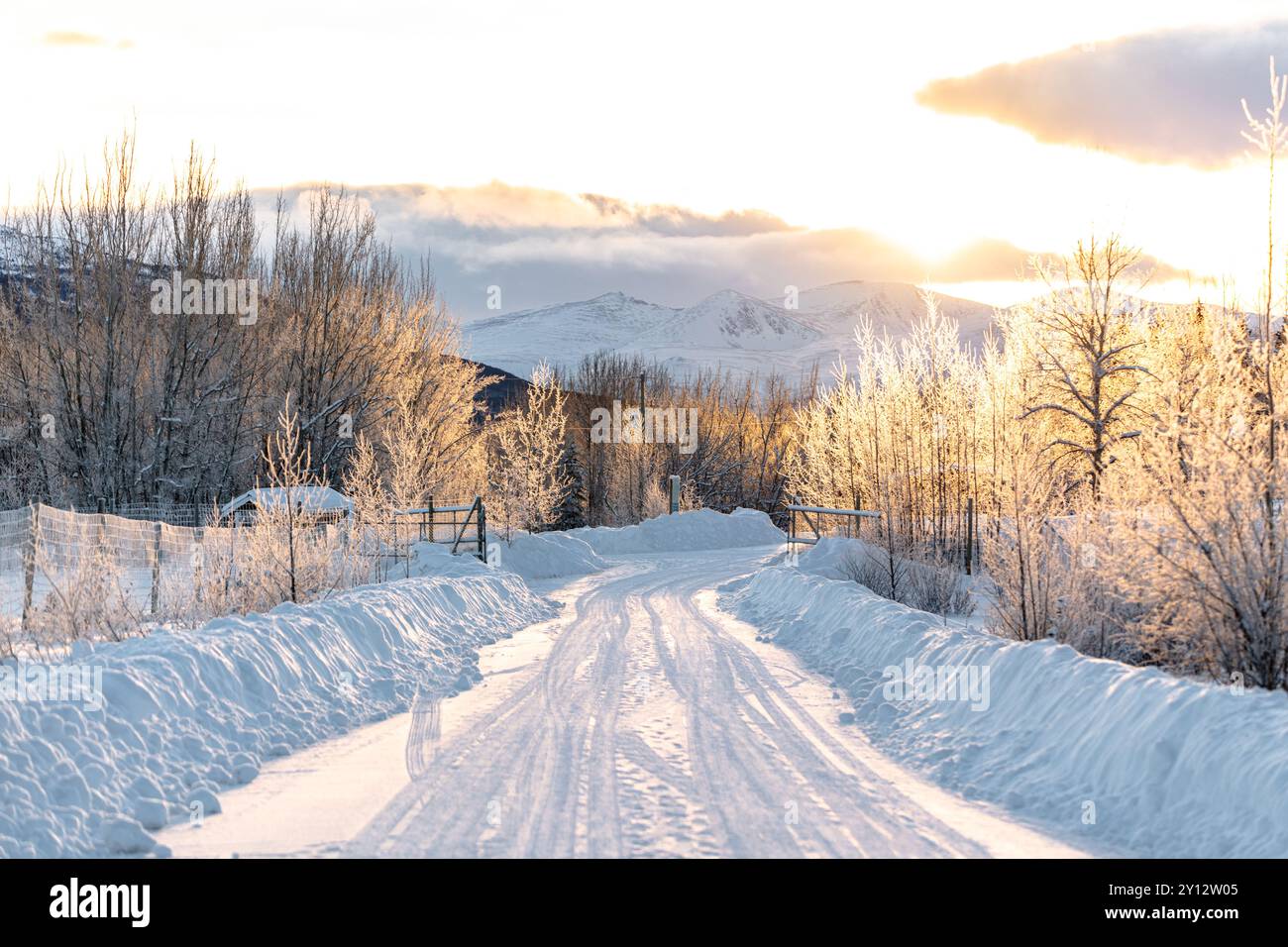 Wilderness road, highway in northern Canada with mountains towering ...
