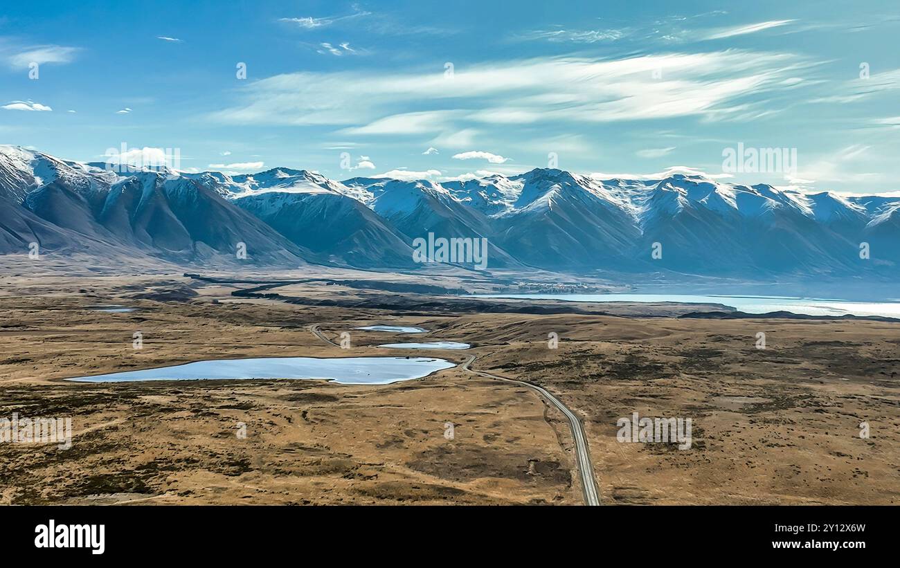 The way to Lake Ohau and the southern alps through alpine grasses and ...