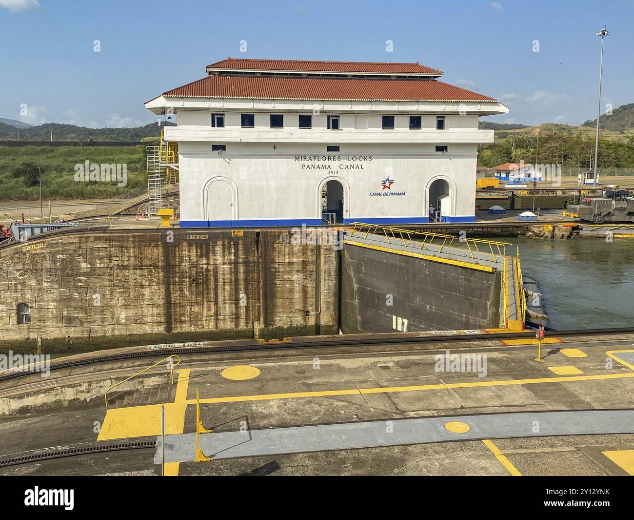 Panama Canal lock building surrounded by waterway and marked parking ...