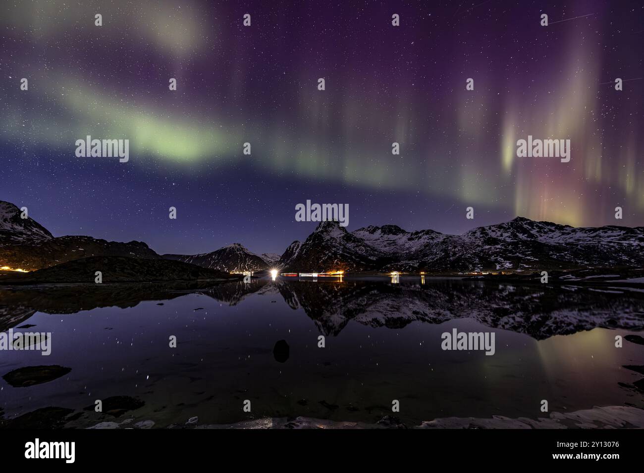 Northern lights over fjord, steep mountains, winter, aurora borealis ...